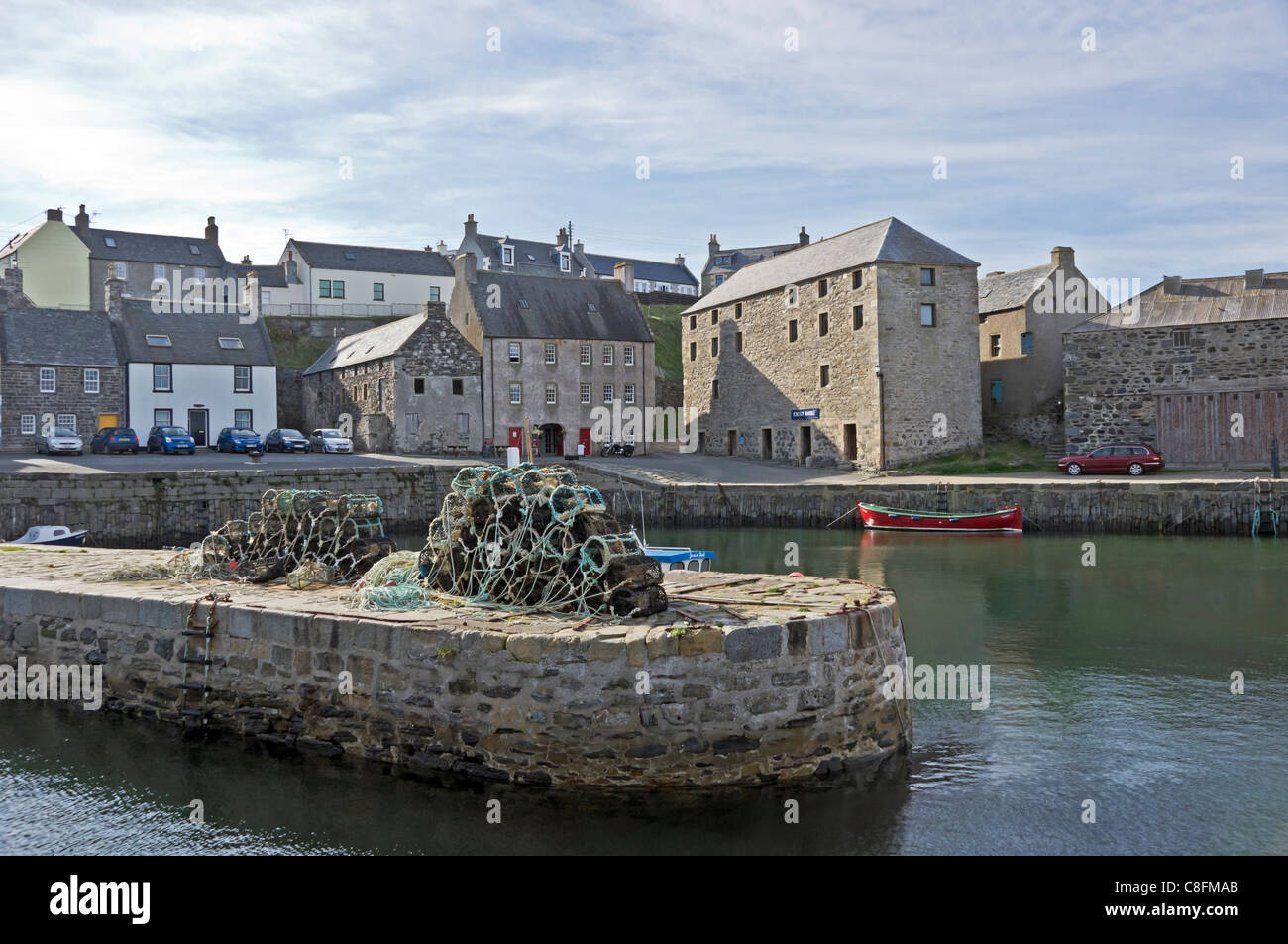 View across the old harbour in Portsoy Scotland towards the old ...