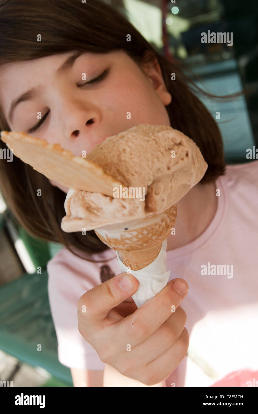 Girl eating "ice cream" gelato cone outdoor in Italy Stock Photo - Alamy