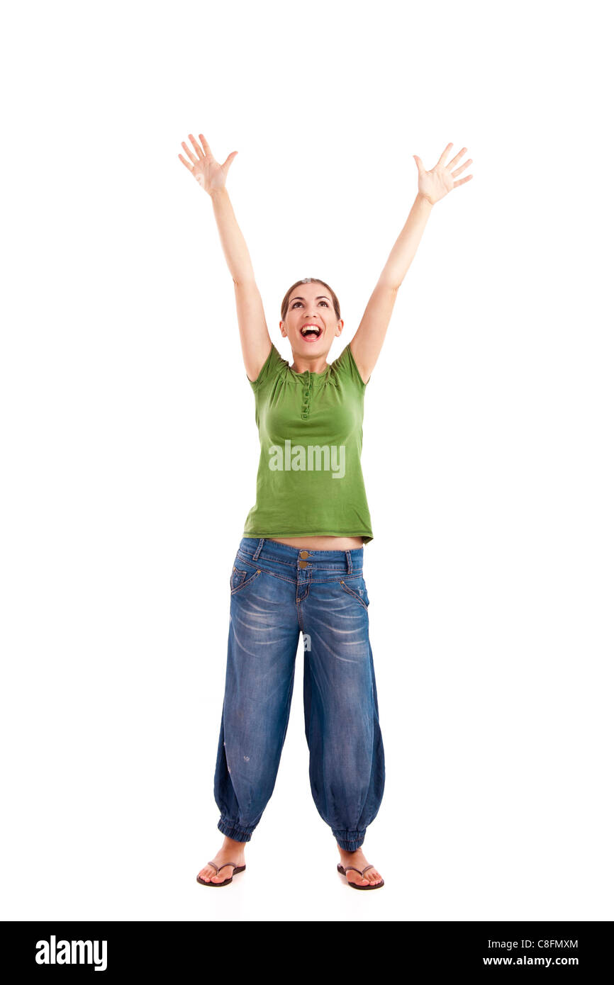 Happy young woman with arms up, isolated against a white background ...