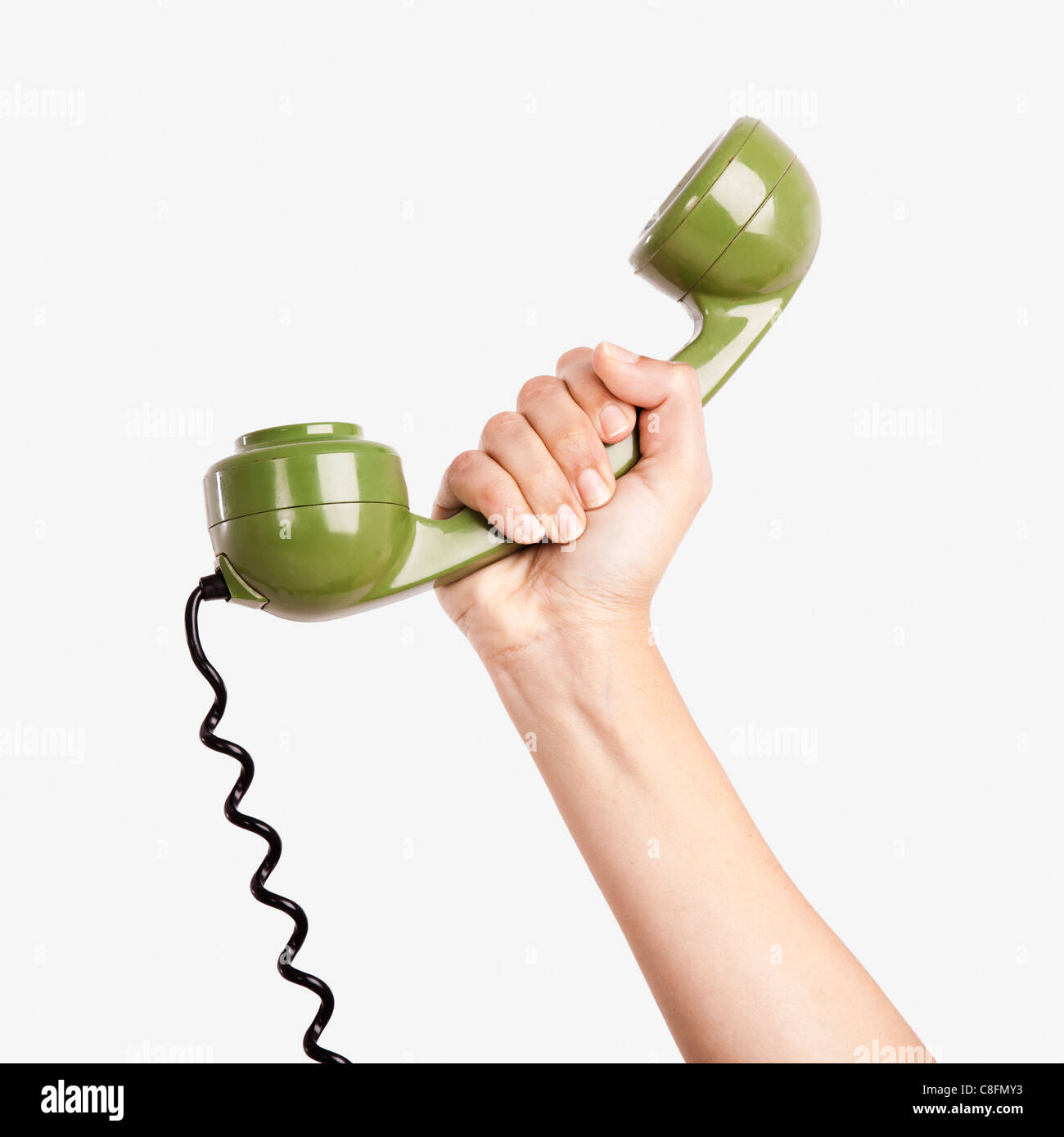 Female hand holding the receiver of an old telephone hi-res stock ...