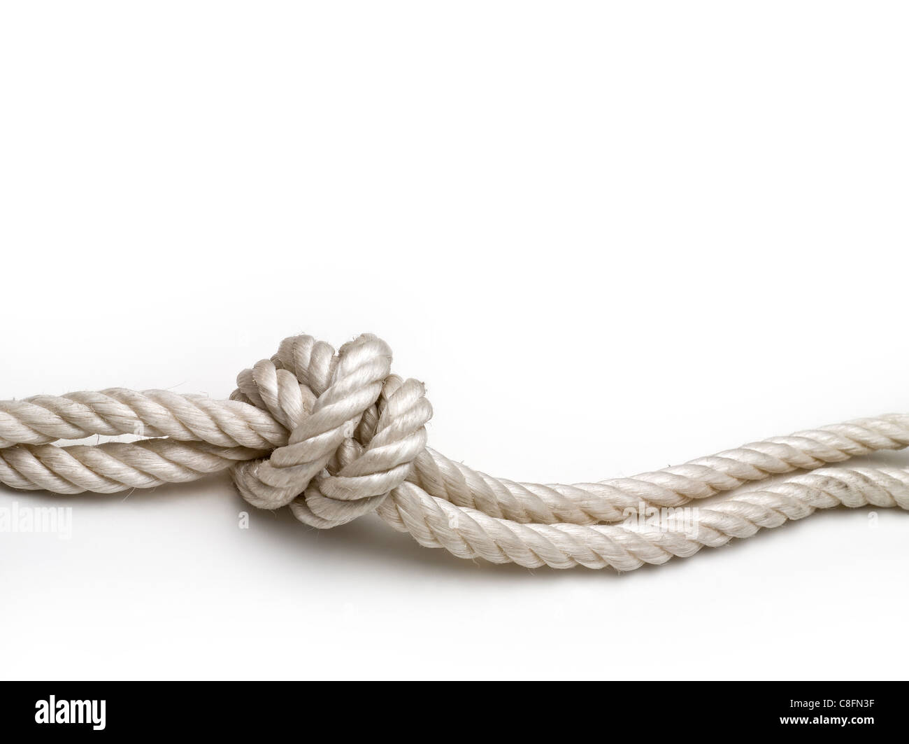 Rope with a knot on white background Stock Photo - Alamy