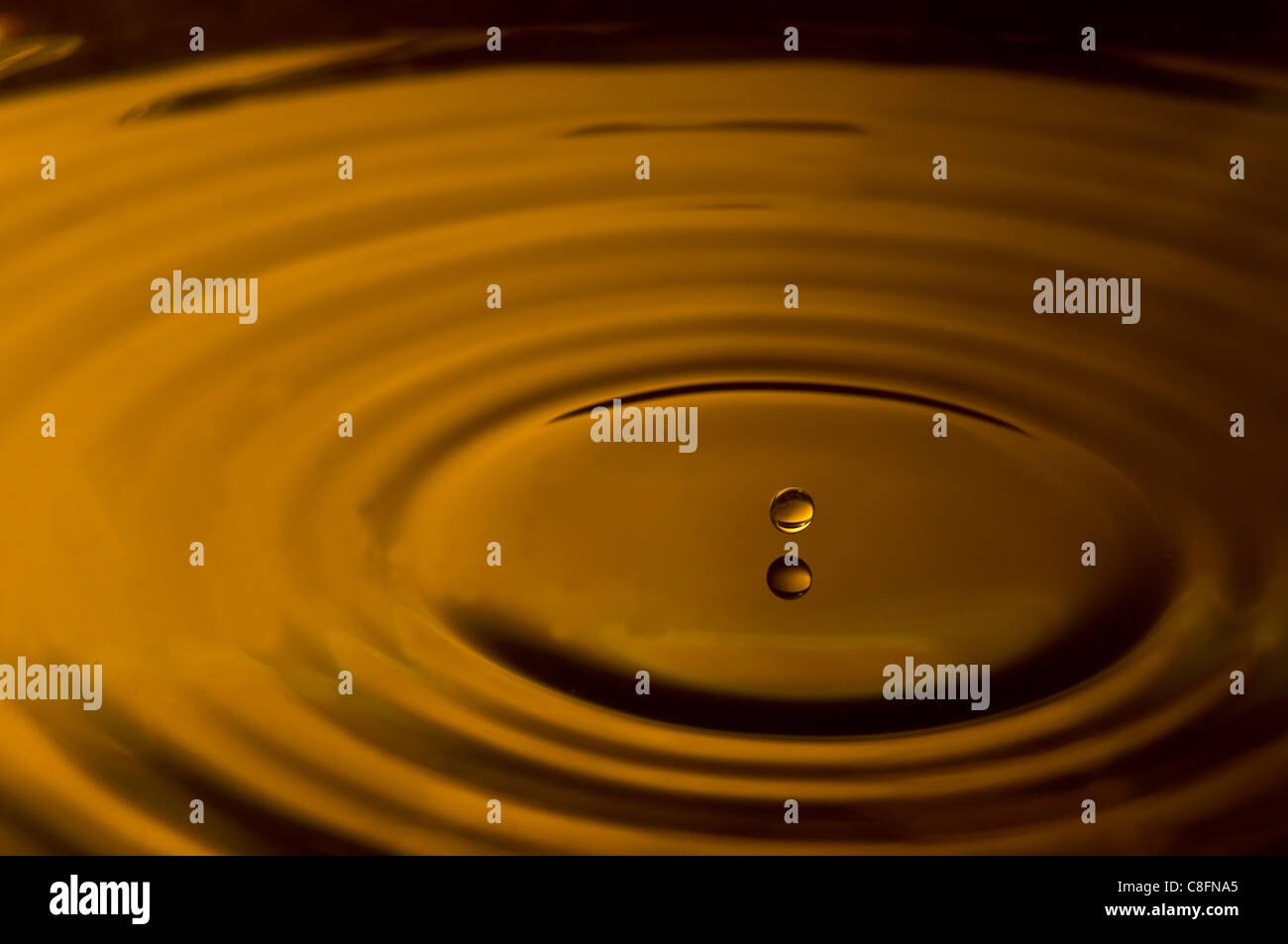 golden water drop Stock Photo - Alamy