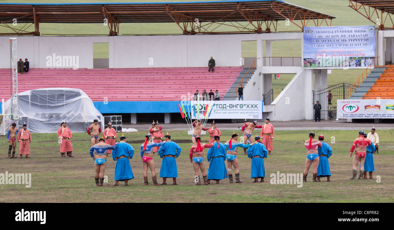 Wrestlers prepare for combat inside the Erdenet Naadam Stadium at the ...