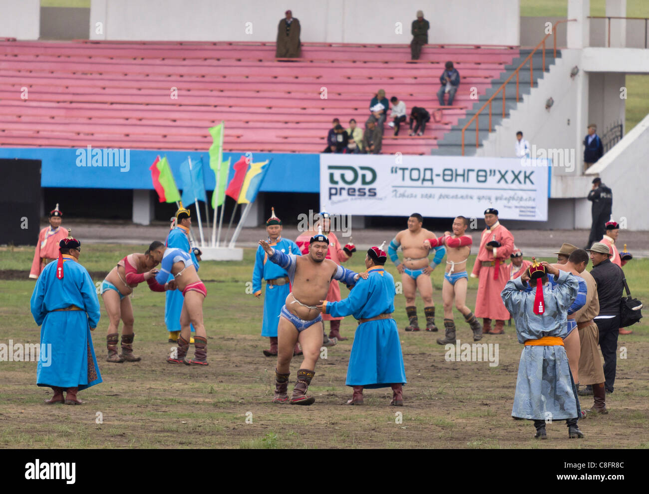 Wrestlers prepare for combat inside the Erdenet Naadam Stadium at the ...