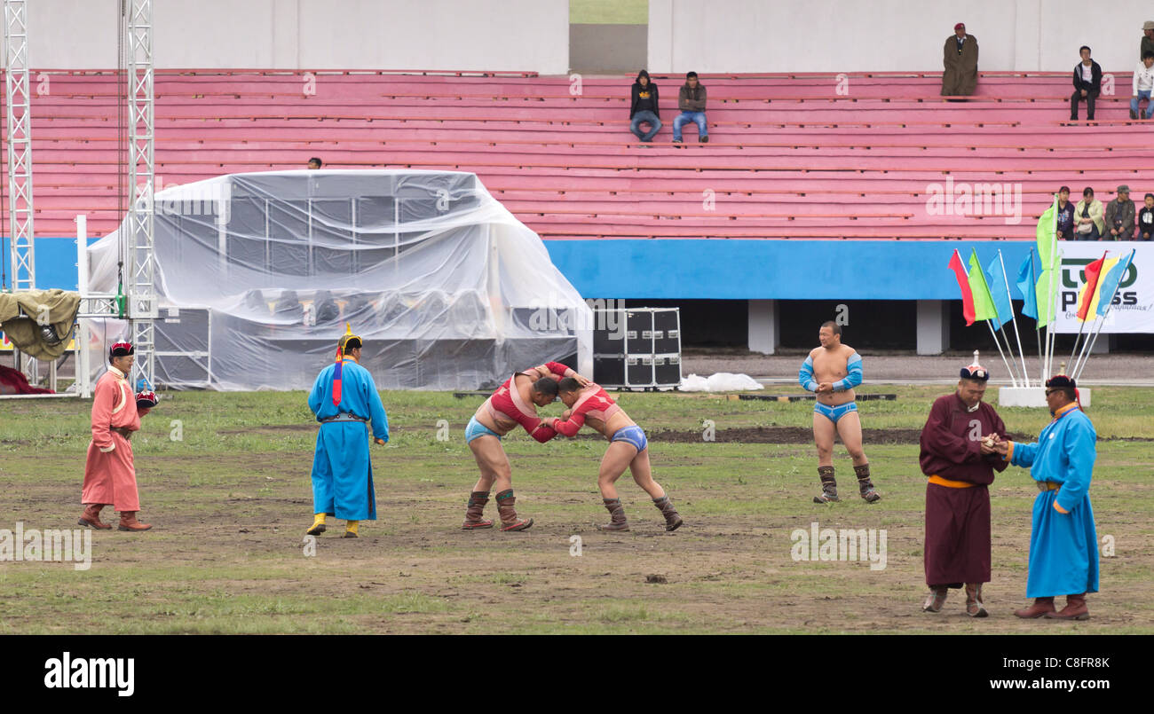 Wrestlers inside the Erdenet Naadam Stadium at the annual Naadam ...