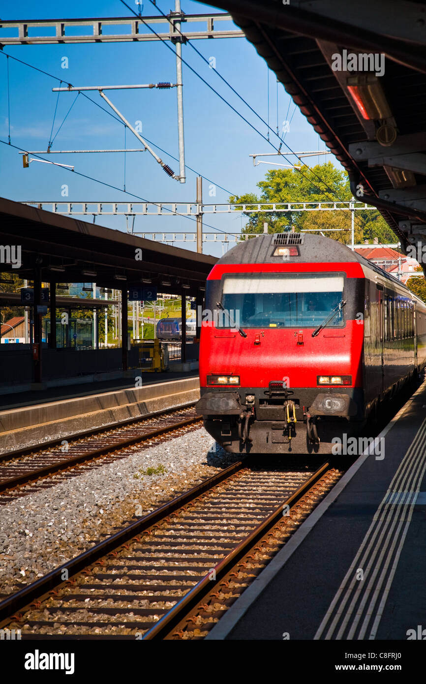 A Swiss inter-regional train arriving at the station of Romont Stock ...