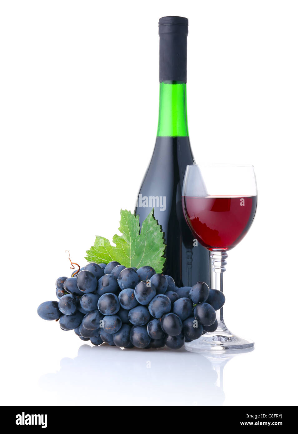 Bottle and goblet of red wine with branch of grapes isolated on white ...