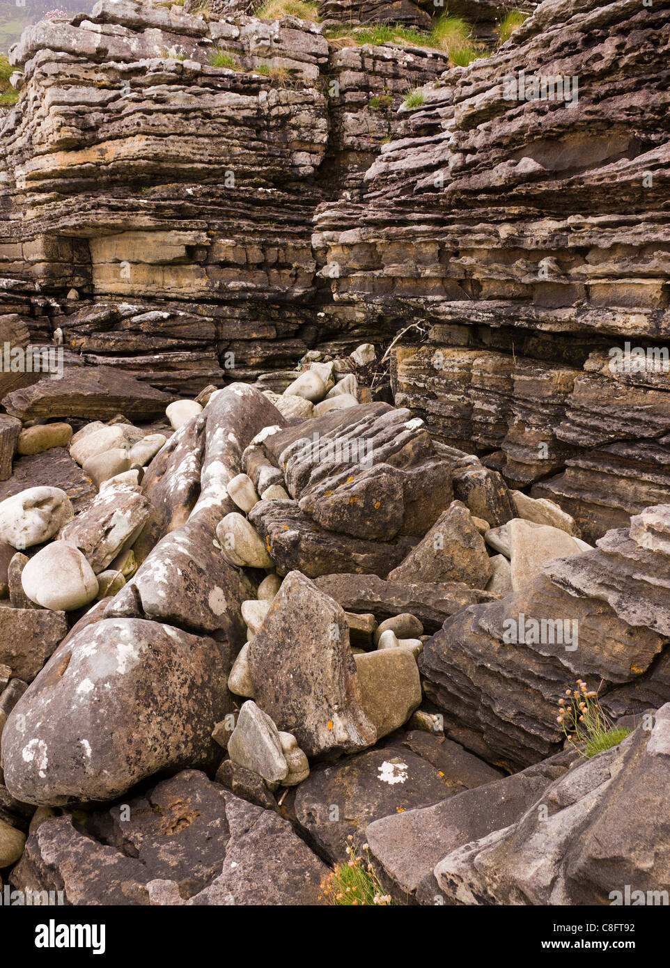 Eroded rocky sea cliffs on the shores of Loch Slapin near Kilmarie ...