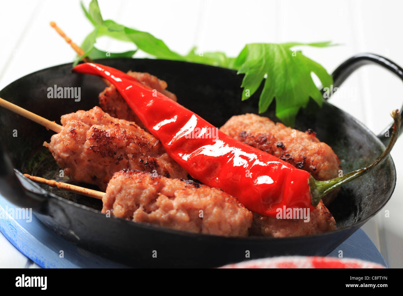 Minced meat kebabs on wooden sticks Stock Photo - Alamy