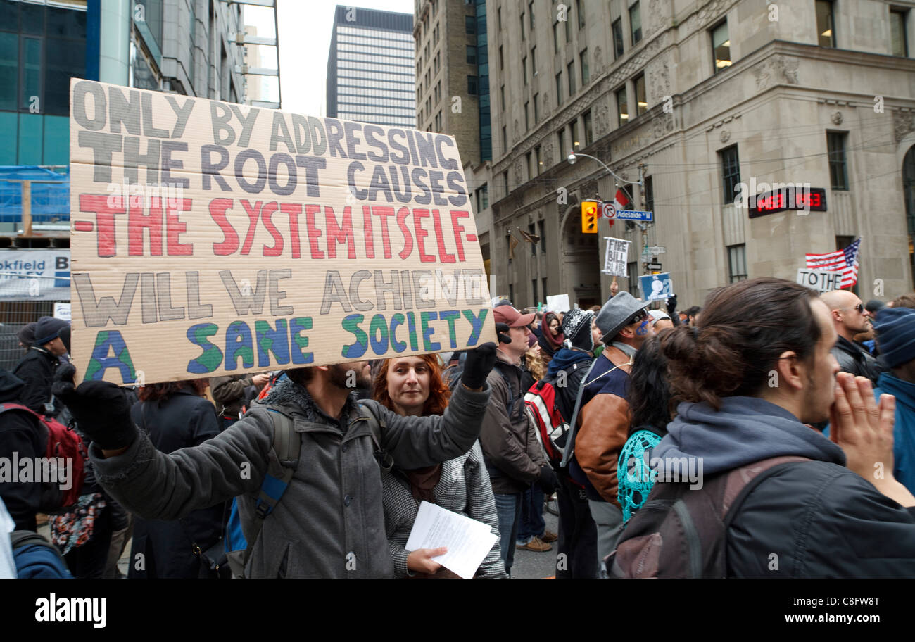 "Occupy Toronto" movement demonstrator holding a sign . October 22 ...
