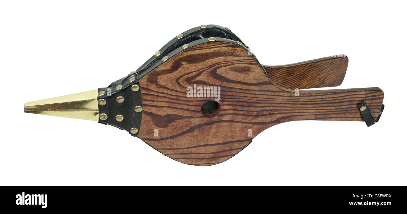 Bellows at the ready for adding air to a fire in the fireplace to make ...