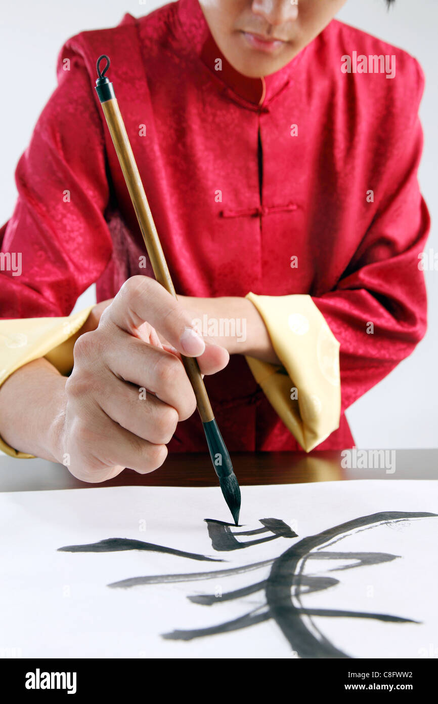 Man writing a chinese character Stock Photo - Alamy