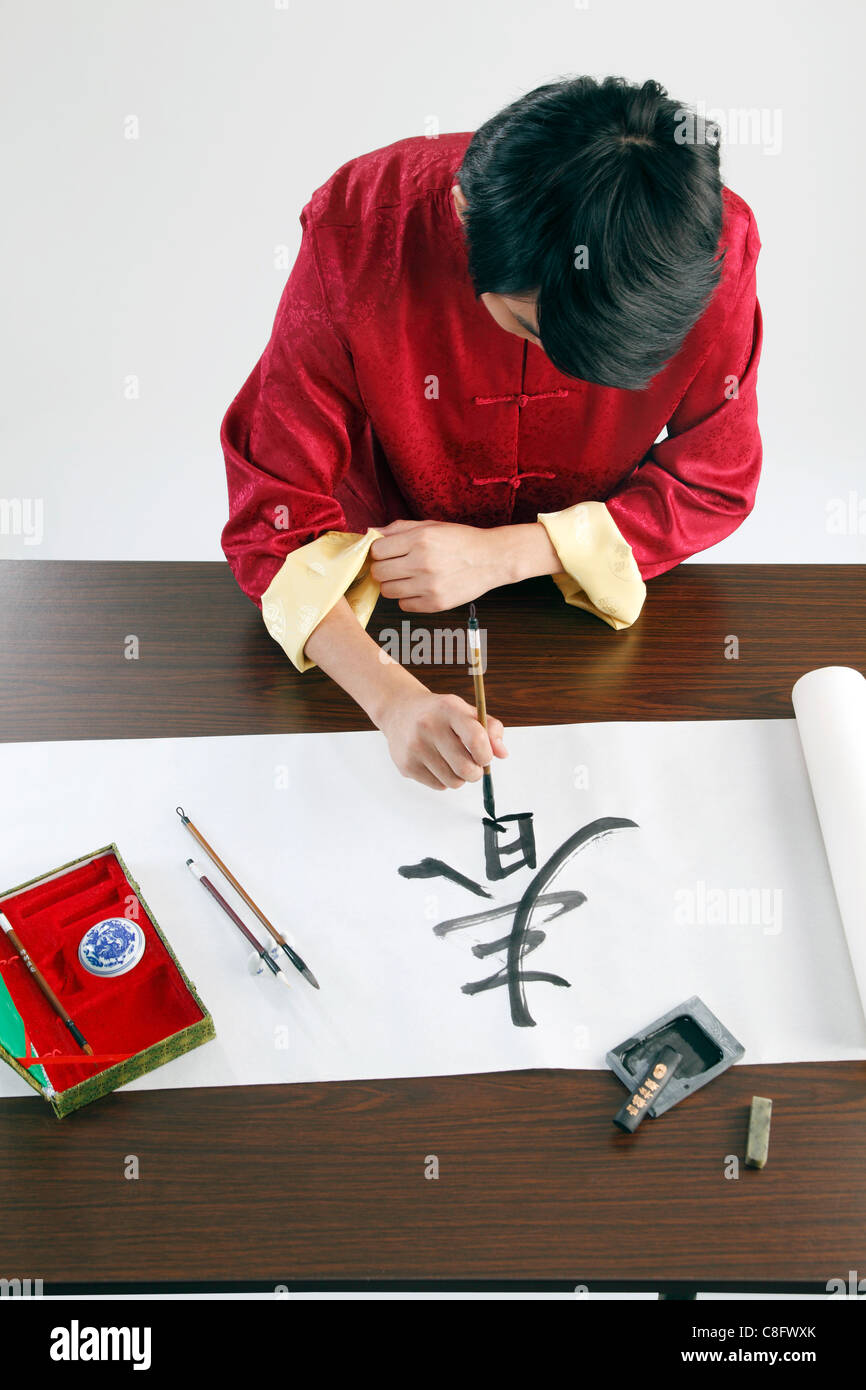 Man writing a chinese character Stock Photo - Alamy