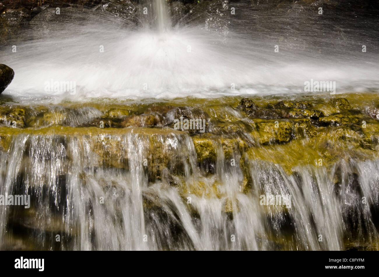 Splashing water on a stone in a small river with water fall Stock Photo ...