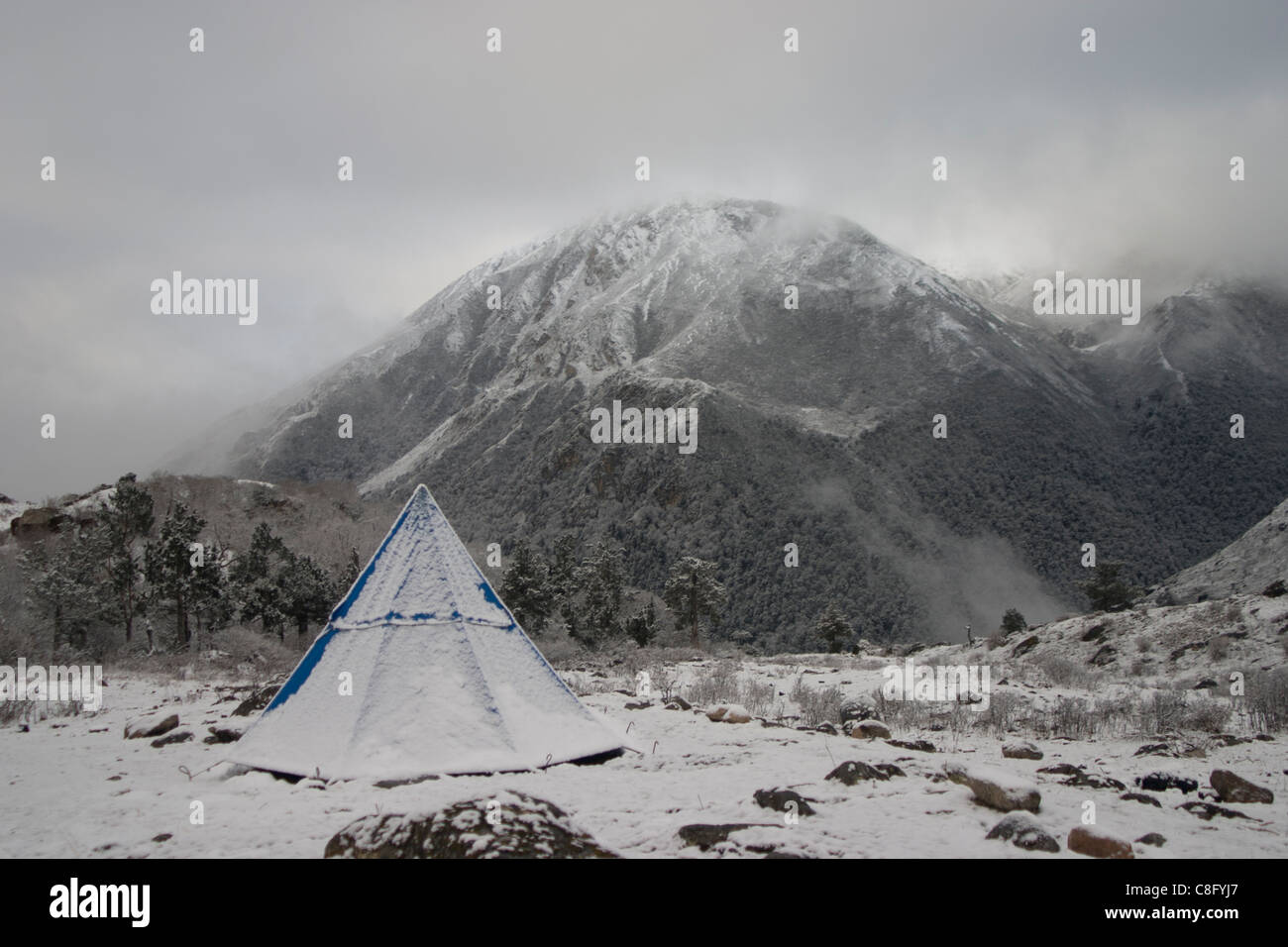 Snow covered tent with remote mountains in background Stock Photo - Alamy