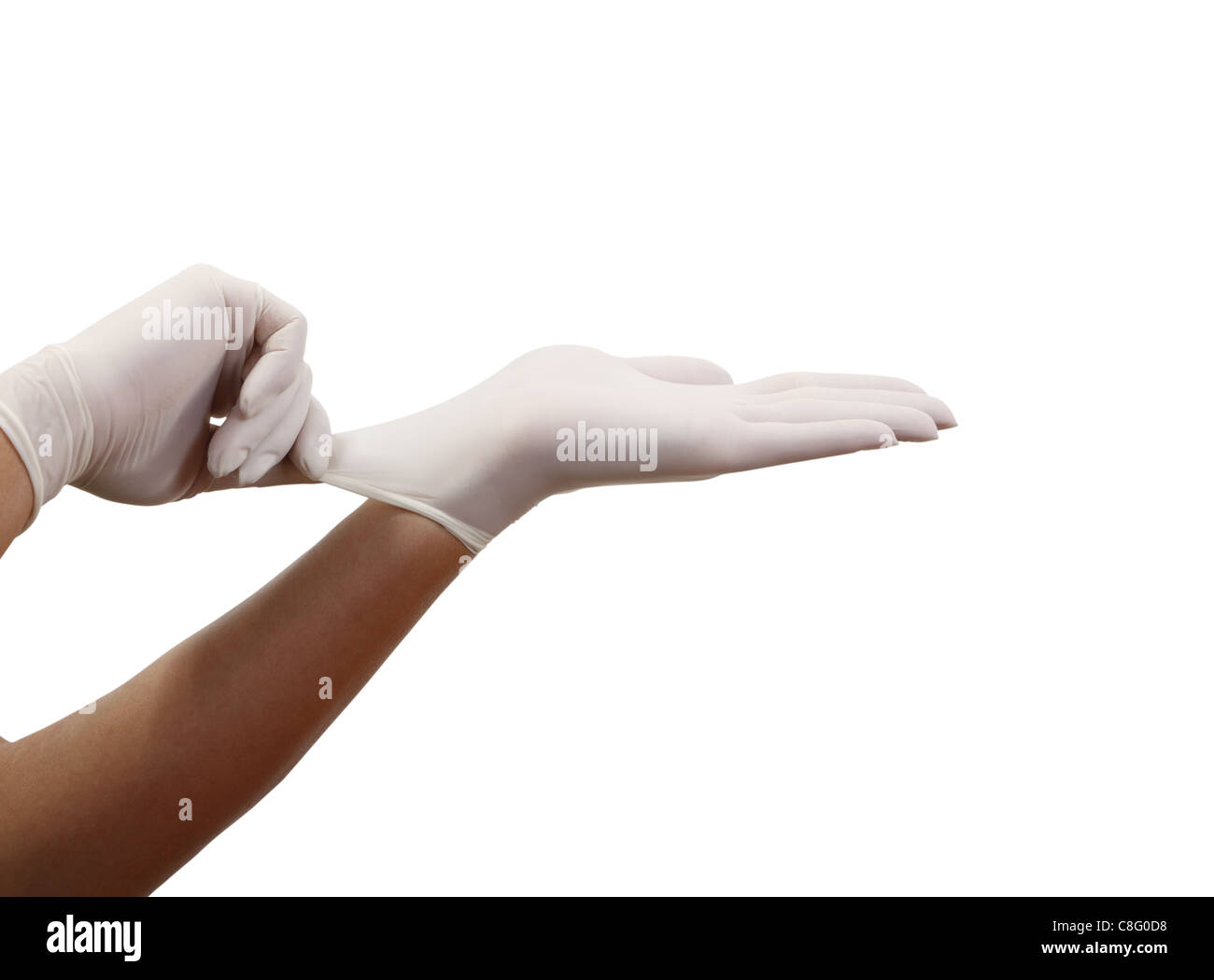 Woman's hands putting on surgical gloves-isolation over white ...