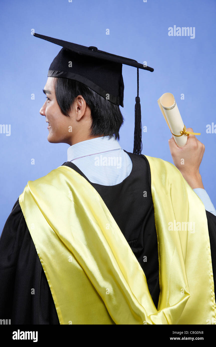 Graduation man diploma raising hi-res stock photography and images - Alamy