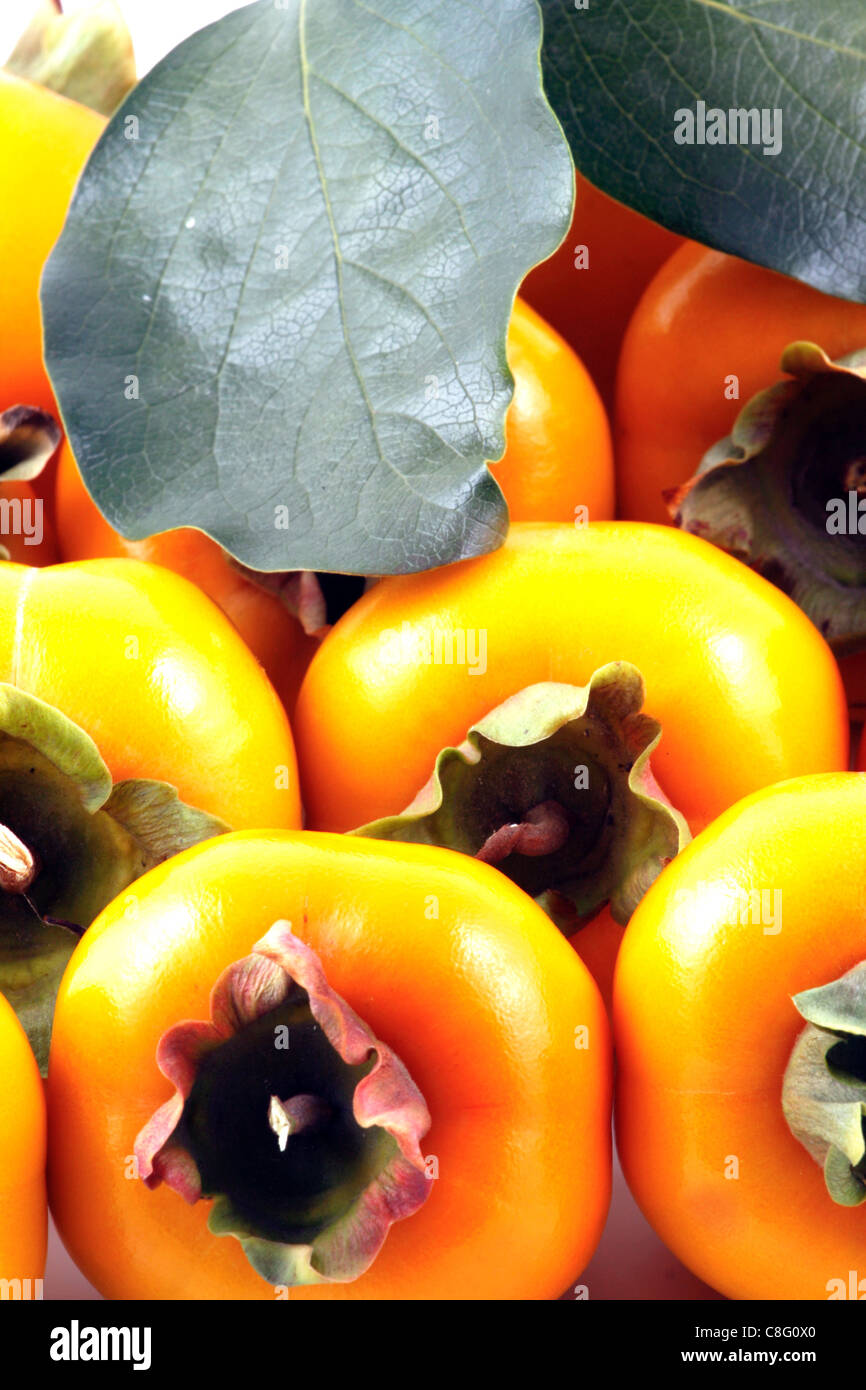 Persimmon on white background Stock Photo - Alamy