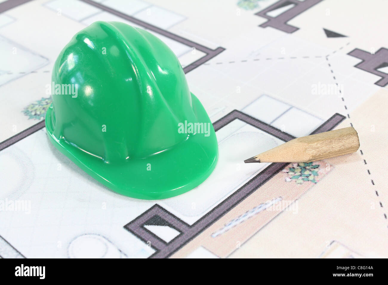 green construction helmet with a pencil and sketch Stock Photo - Alamy