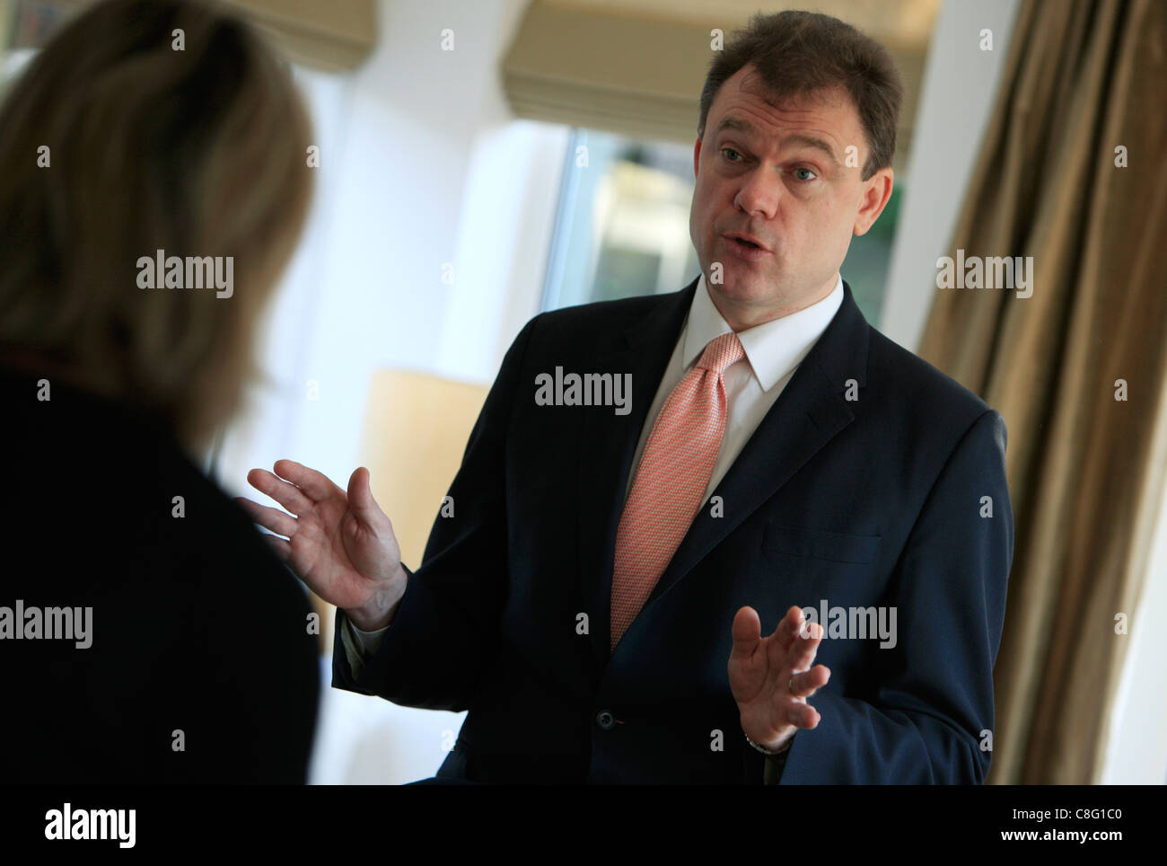 Businessman speaks with client during a business meeting Stock Photo ...
