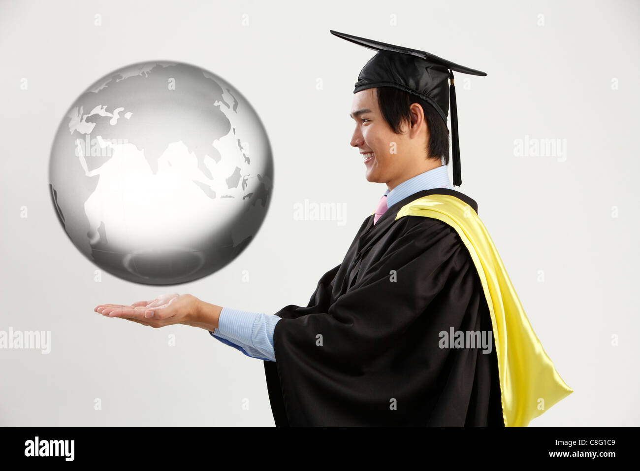 graduated student with the blobe Stock Photo - Alamy