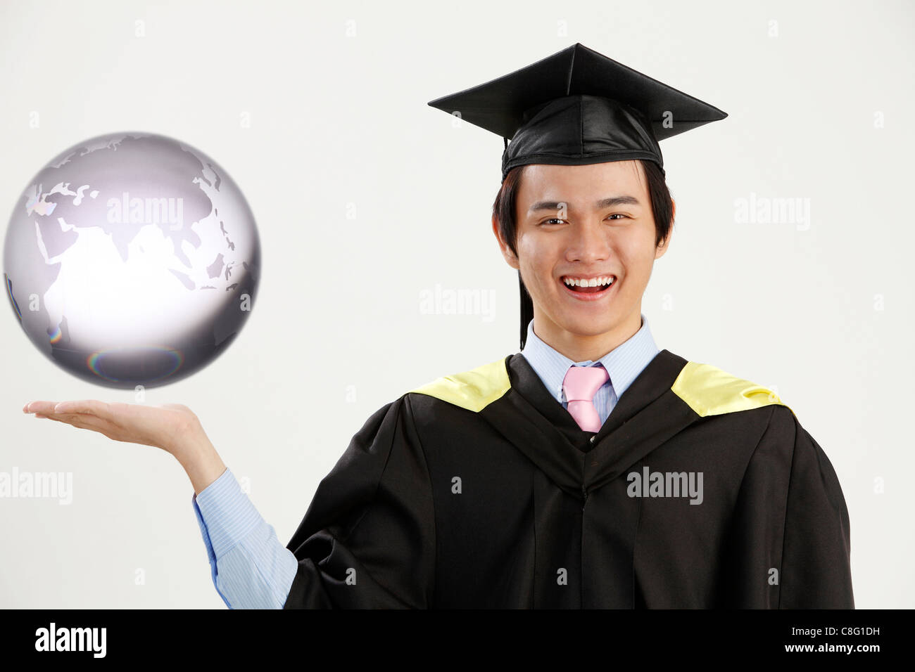 graduated student with the blobe Stock Photo - Alamy