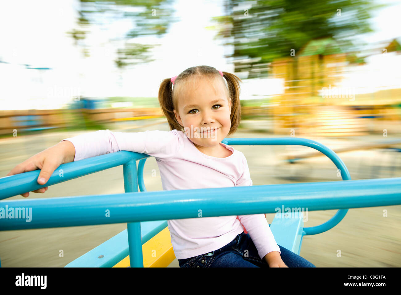 Merry go round spin playground hi-res stock photography and images - Alamy