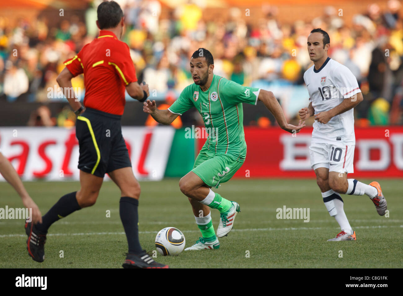 Nadir Belhadj of Algeria controls the ball during a 2010 FIFA World Cup ...