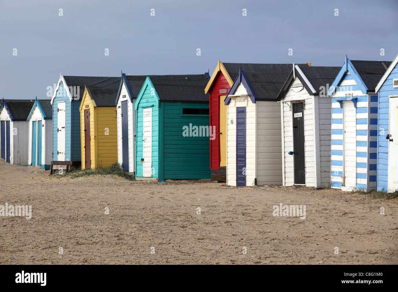 Colorful row of Wooden Beach Bathing Huts on Southwold Beach Strand ...