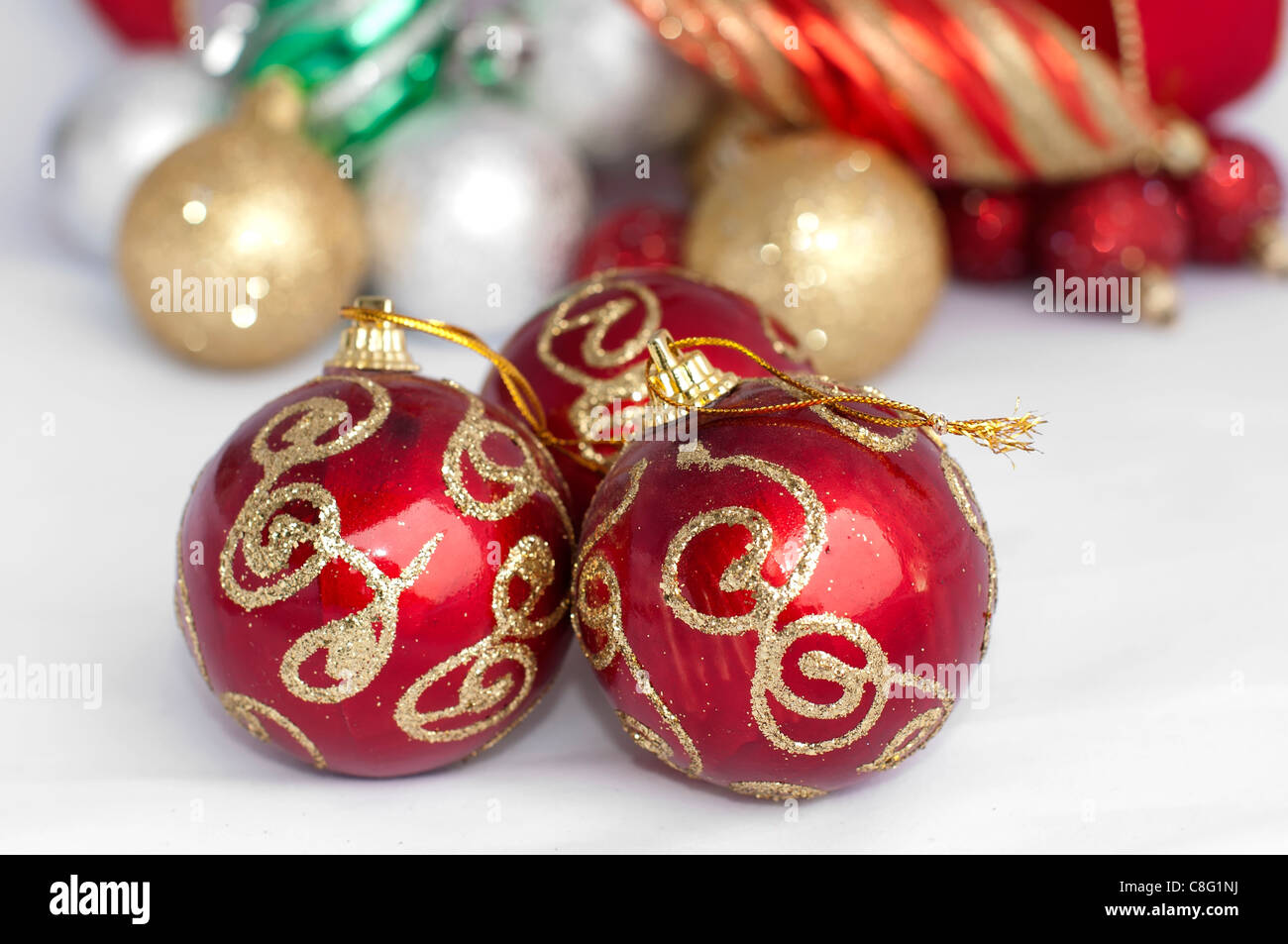 Christmas motifs with balls and chains. Red and white balls, white ...
