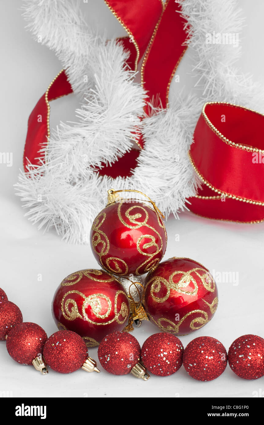 Christmas motifs with balls and chains. Red and white balls, white ...