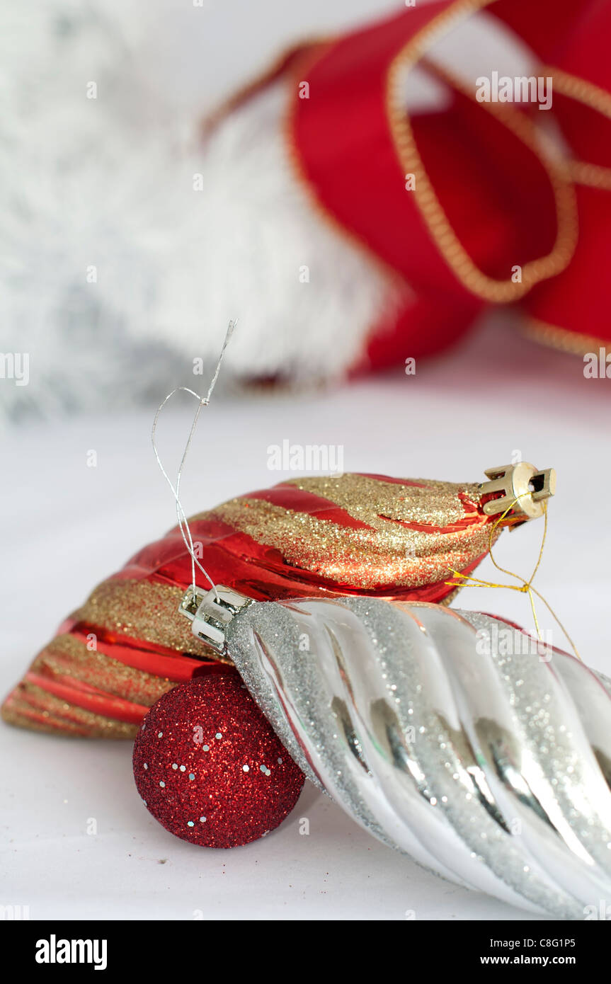 Christmas motifs with balls and chains. Red and white balls, white ...