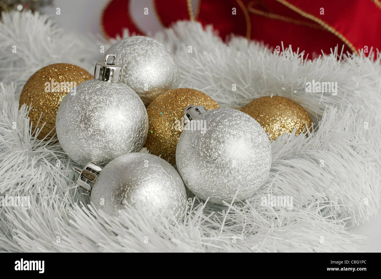 Christmas motifs with balls and chains. Red and white balls, white ...
