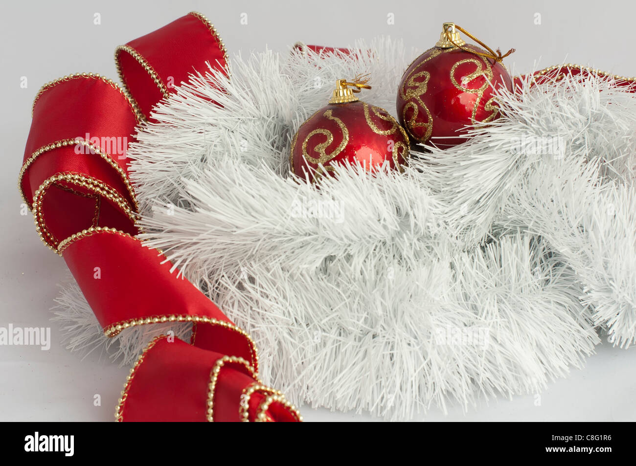 Christmas motifs with balls and chains. Red and white balls, white ...