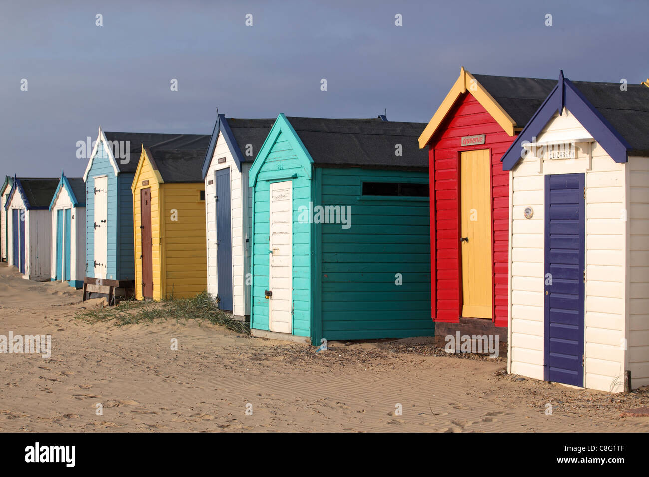 Colorful row of Wooden Beach Bathing Huts on Southwold Beach Strand ... Colorful row of Wooden Beach Bathing Huts on Southwold Beach Strand ...