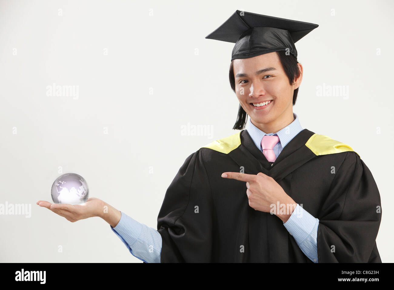 graduated student with the blobe Stock Photo - Alamy