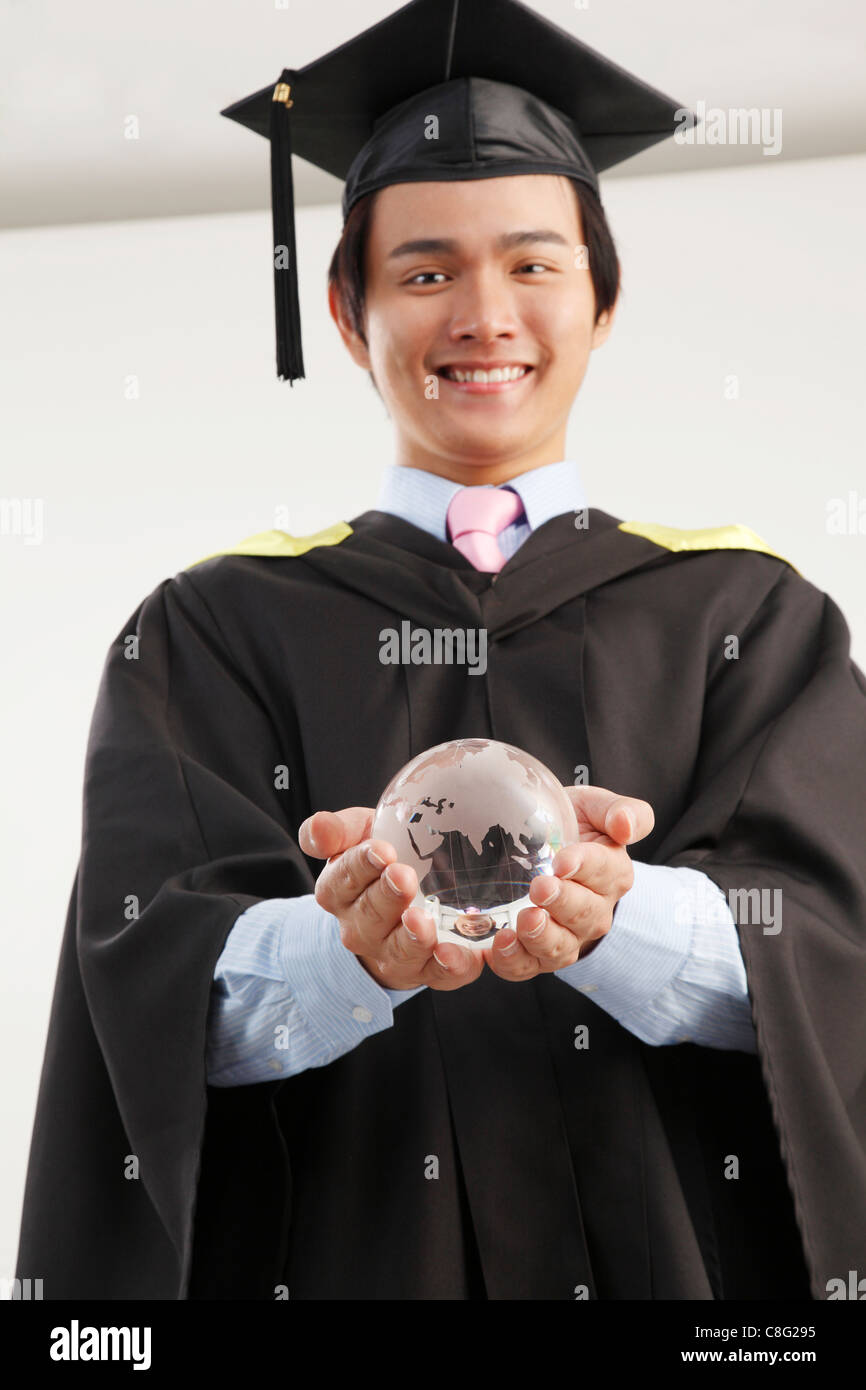 graduated student with the blobe Stock Photo - Alamy