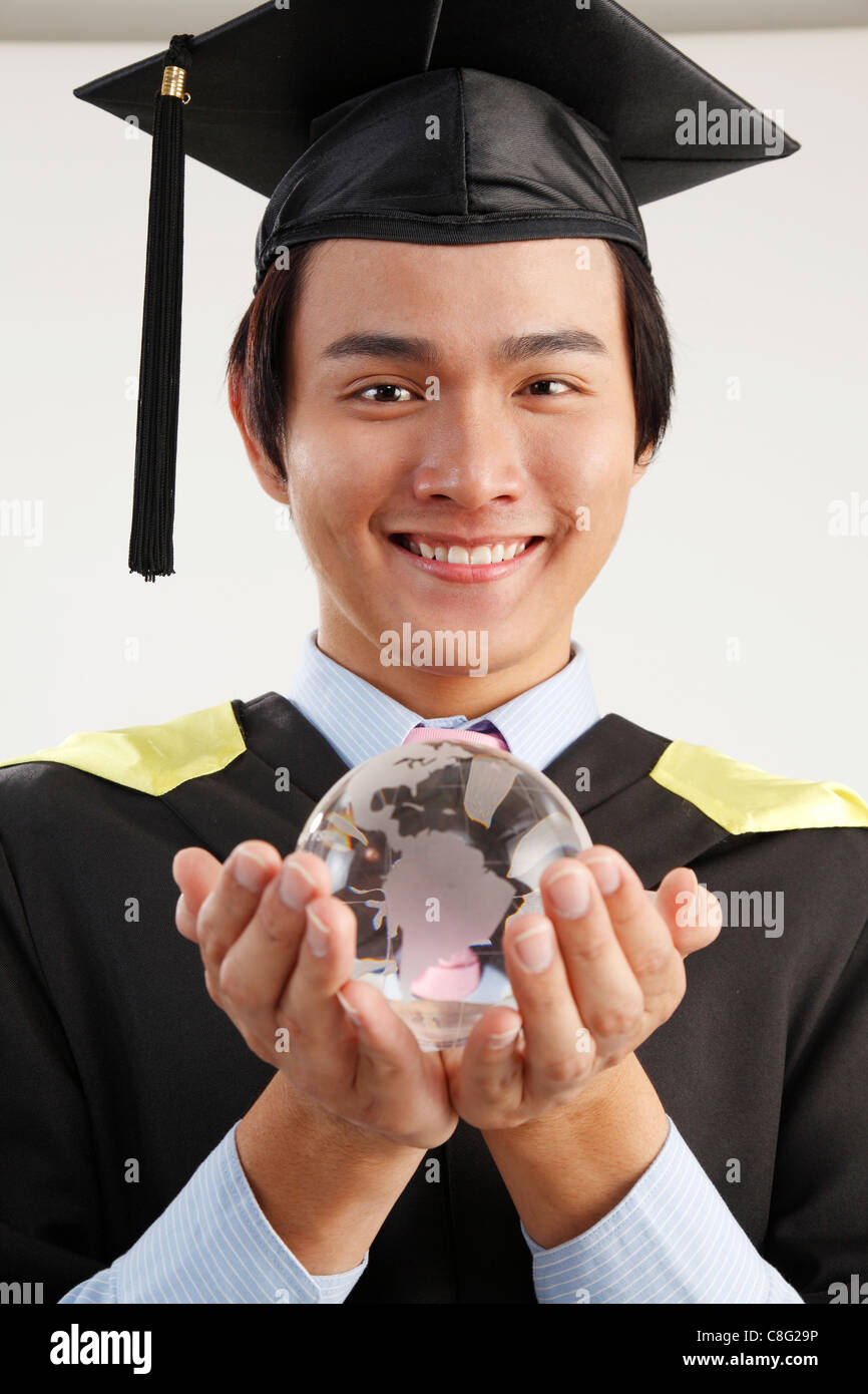 graduated student with the blobe Stock Photo - Alamy