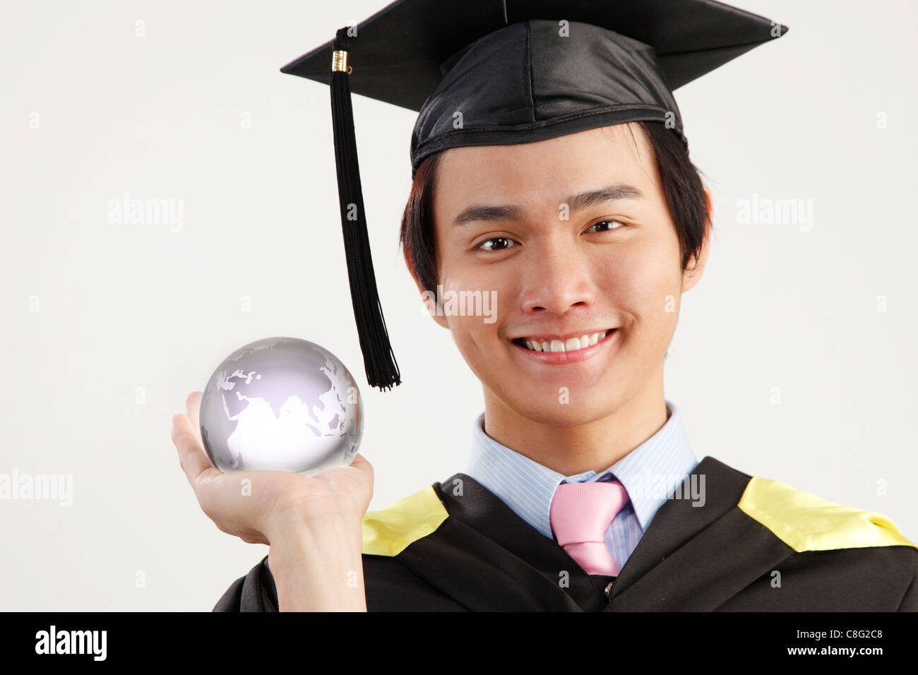 graduated student with the blobe Stock Photo - Alamy