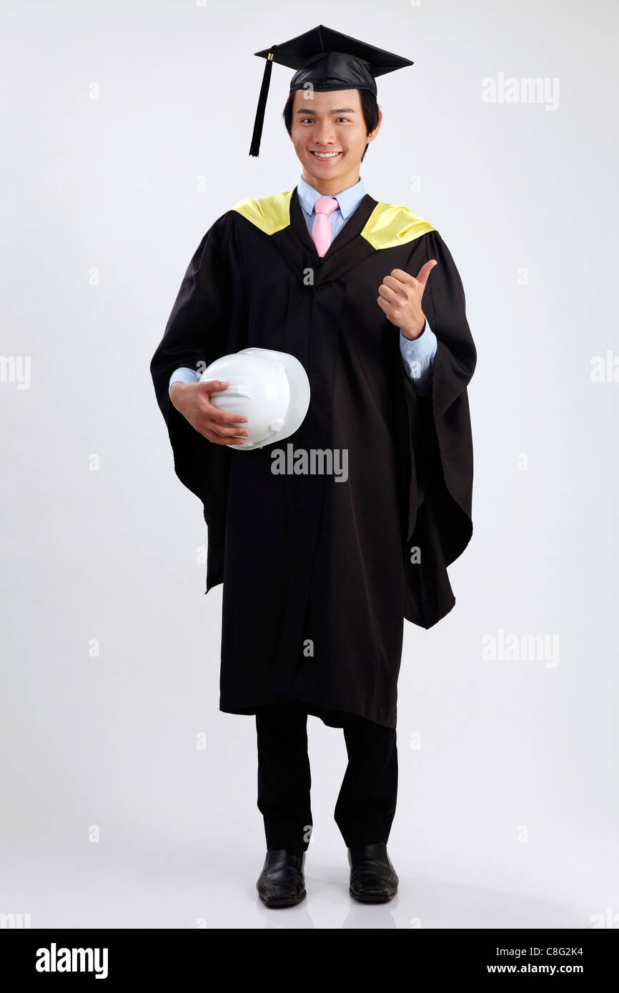 male graduated holding a safety helmet Stock Photo - Alamy