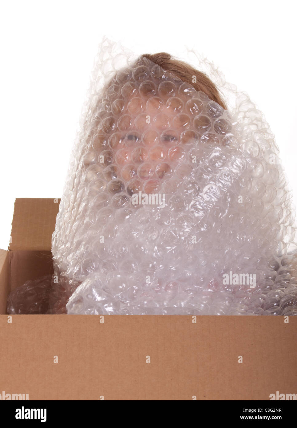 An excellent image of a cute child being packaged up into a shipping ...