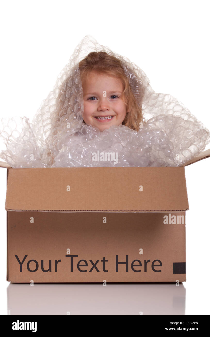 An excellent image of a cute child being packaged up into a shipping ...