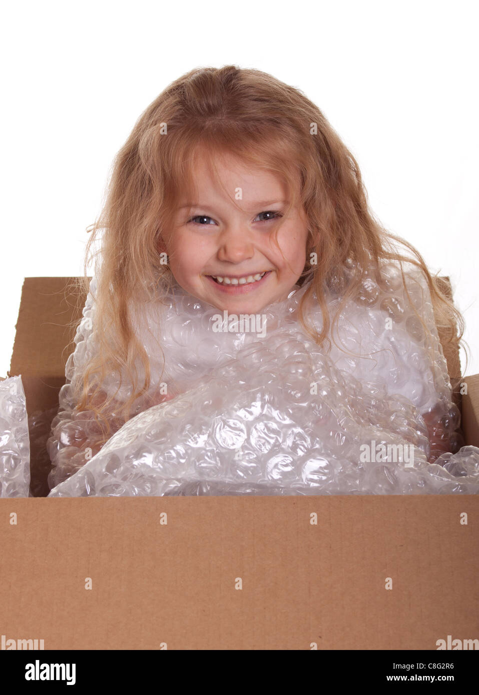 An excellent image of a cute child being packaged up into a shipping ...