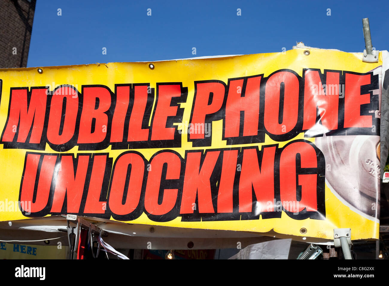 Mobile phone unlocking banner Stock Photo - Alamy