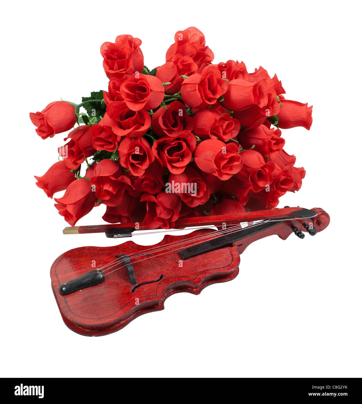 A classical gathering of long-stem red roses with a wooden violin ...
