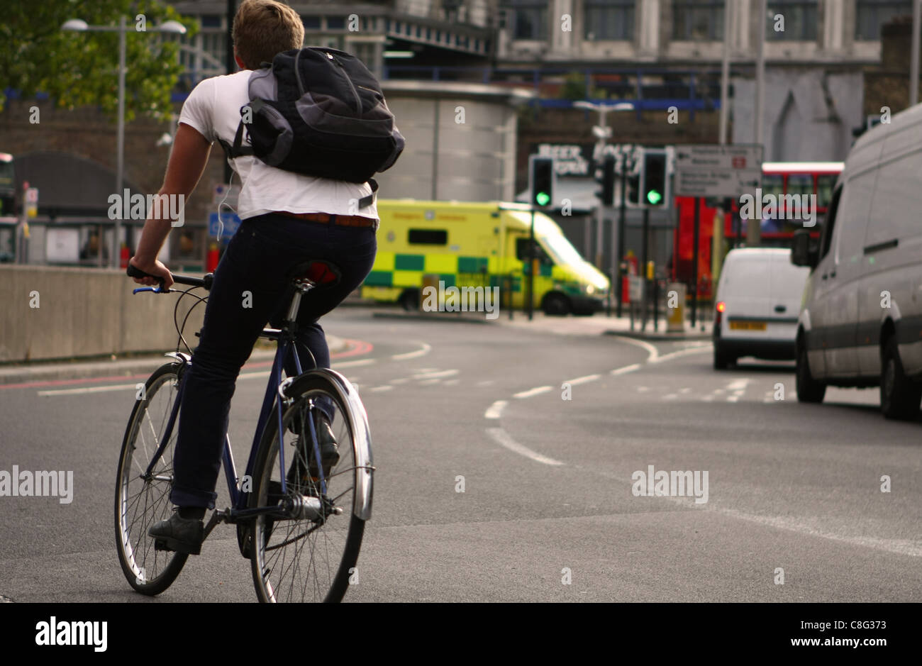 a cyclist traveling around a roundabout Stock Photo - Alamy