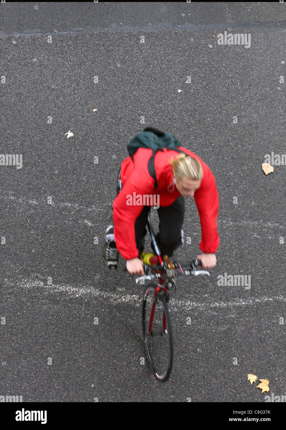 Looking down on a cyclist traveling along a road in London Stock Photo ...