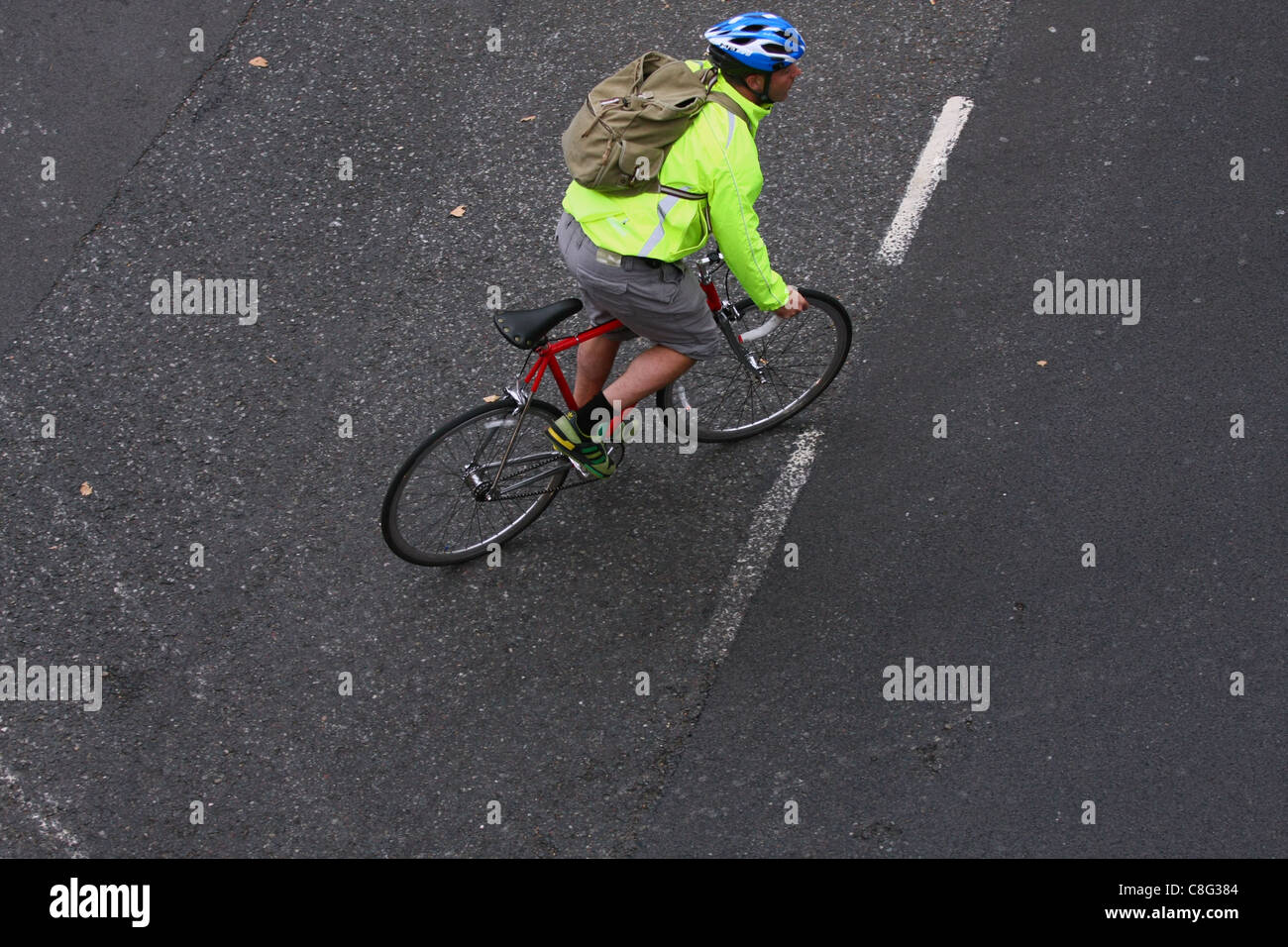 Looking down on a cyclist traveling across a road in London Stock Photo ...