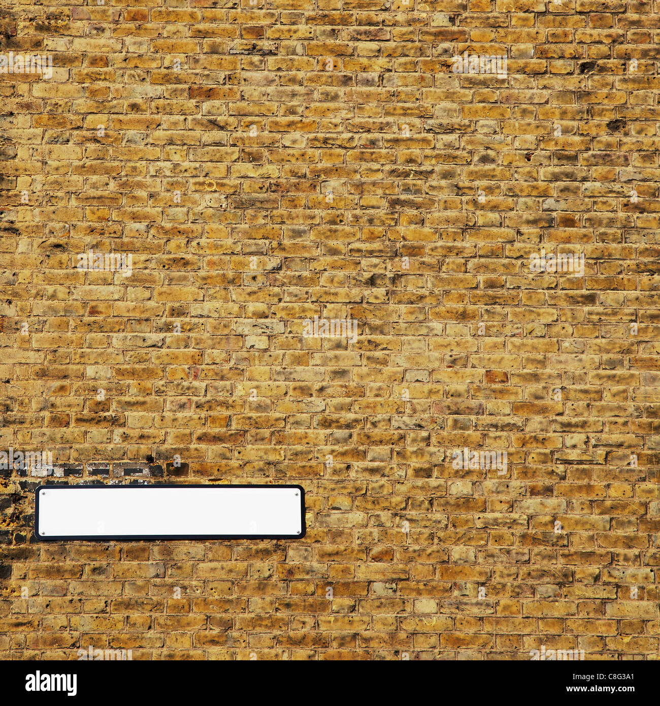 Plain Brick Wall with a Blank Street Name Sign (own text can be added ...