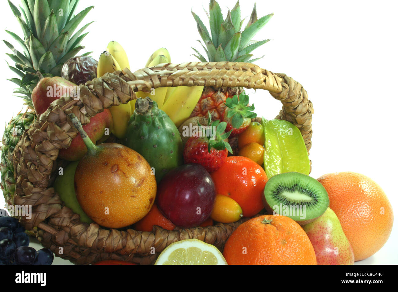 Fruit basket with various indigenous and exotic fruits on white ...